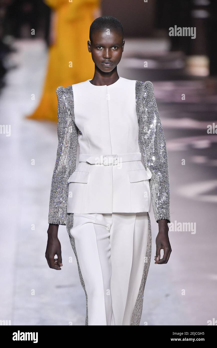 Model Amar Akway walks on the runway during the Givenchy Haute Couture ...