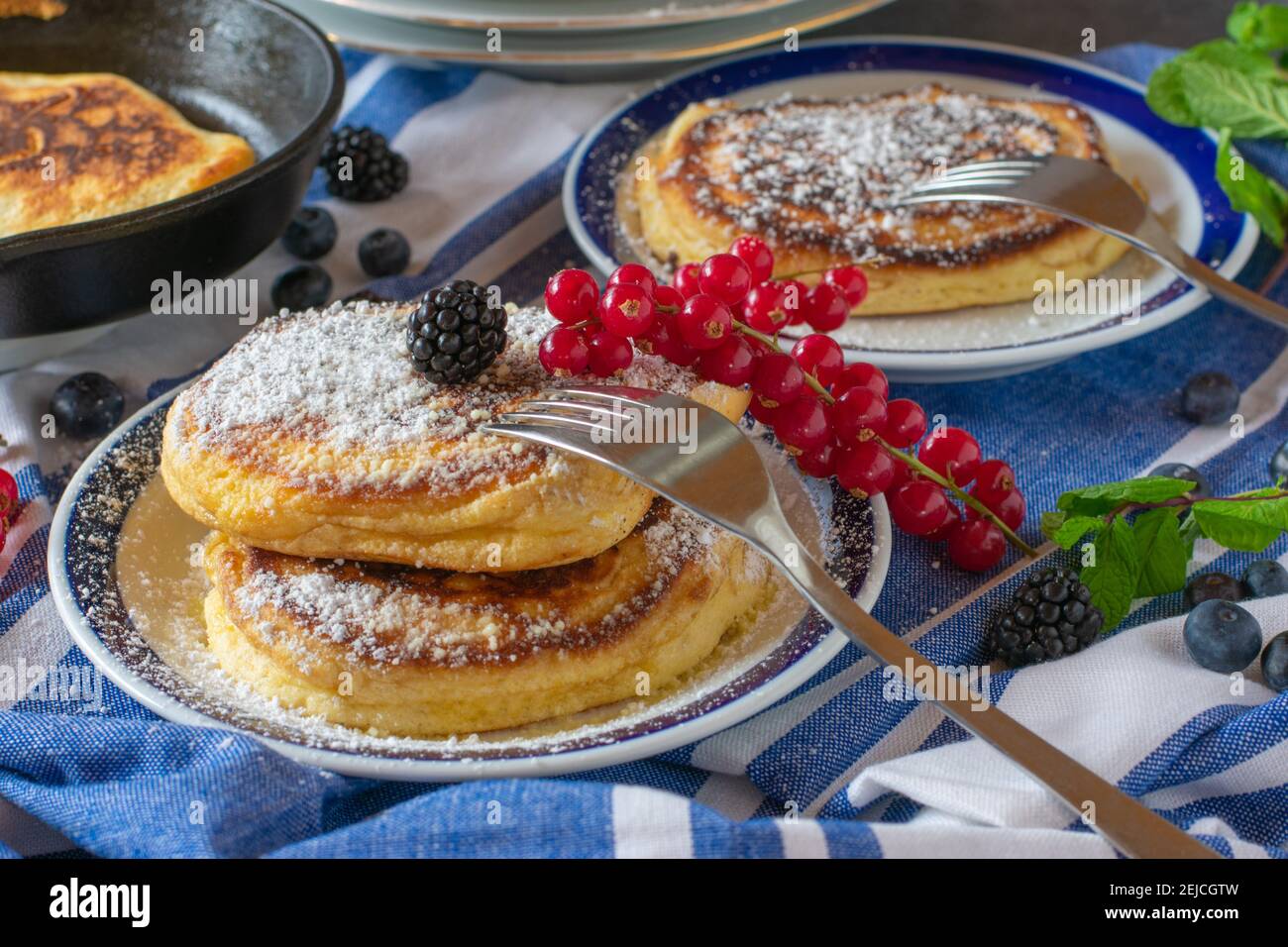 Dutch fluffy pancakes served on a breakfast table Stock Photo - Alamy