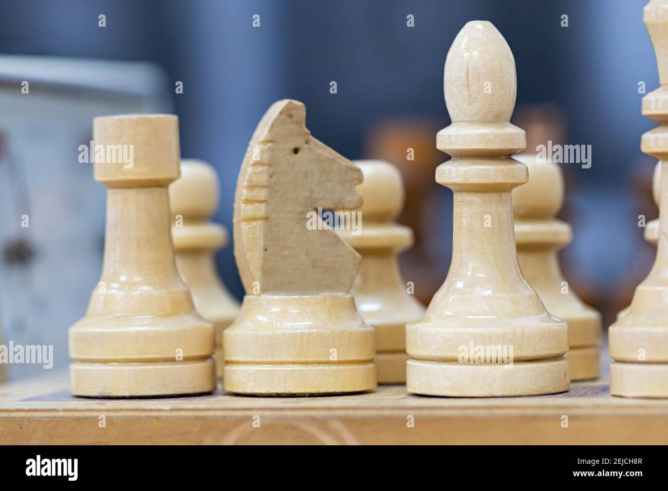 Playing wooden chess on a chessboard. Tactics and strategy. Black and white shapes Stock Photo ...