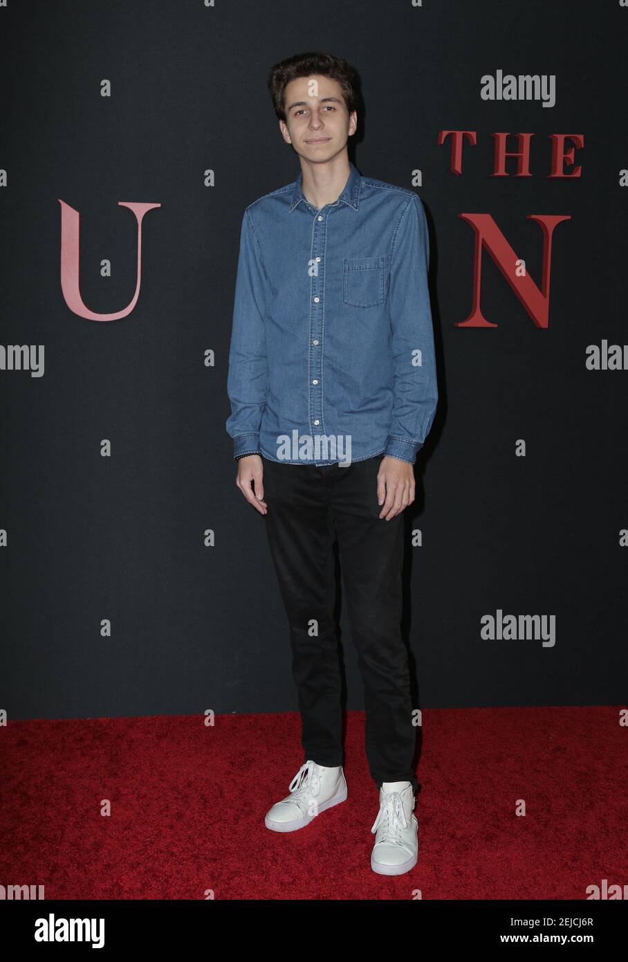 Gabe Erwin walking the red carpet at the Premiere of Universal Pictures ...