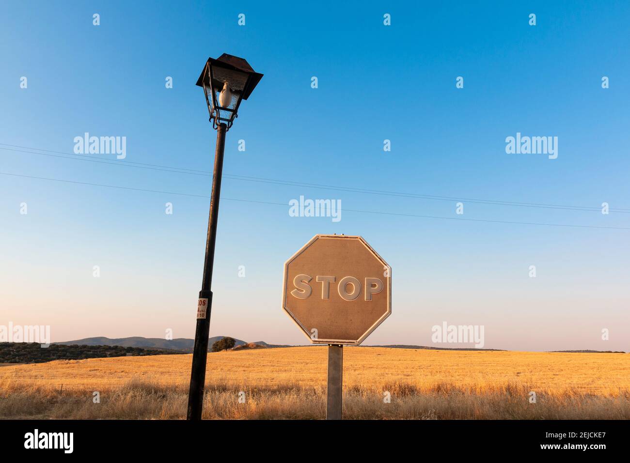 Sun-faded stop sign in southern spain Stock Photo - Alamy