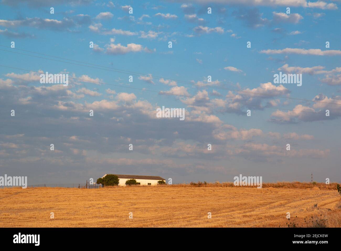 Agricultural farm in southern Andalusia with a cloud filled sky in ...