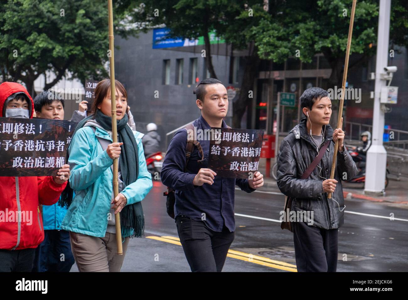 Protesters hold placards during the march. International Socialist ...