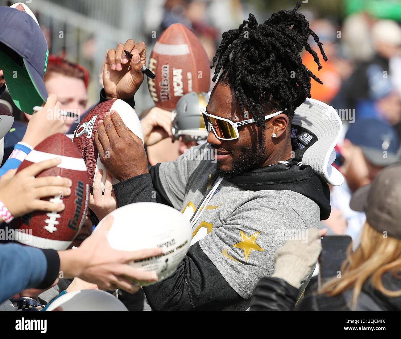 NFC Team Dallas Cowboys linebacker Jaylon Smith signs autographs during ...