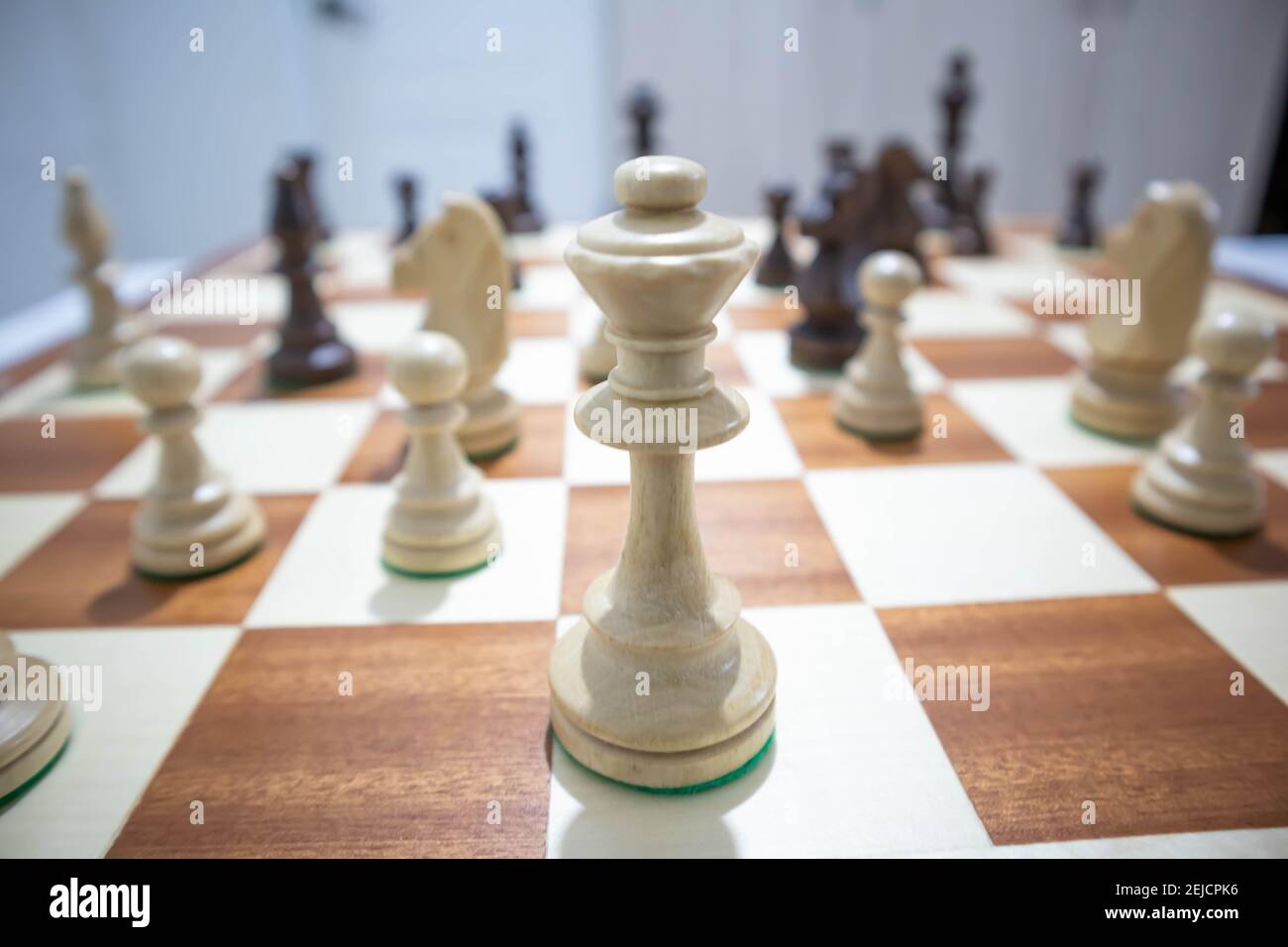 Playing wooden chess on a chessboard. Tactics and strategy. Black and white shapes Stock Photo ...