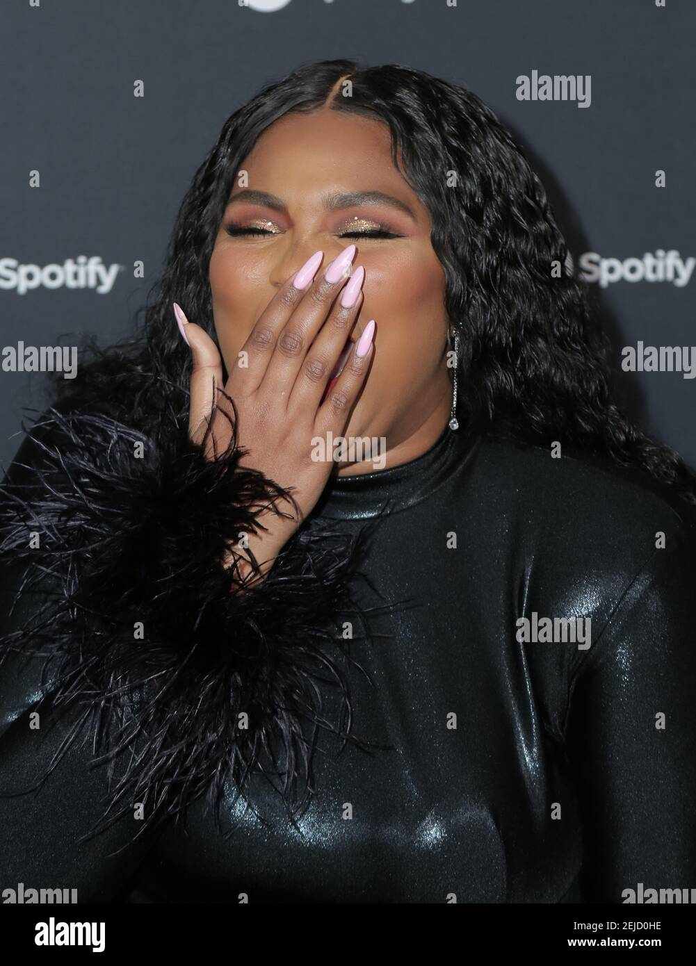 Lizzo walking the red carpet at the Spotify Hosts "Best New Artist ...