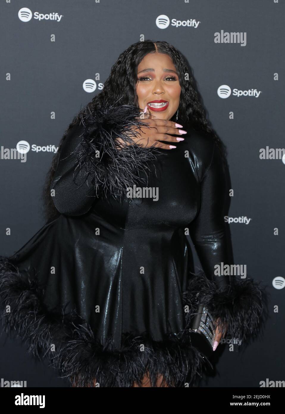 Lizzo walking the red carpet at the Spotify Hosts "Best New Artist ...