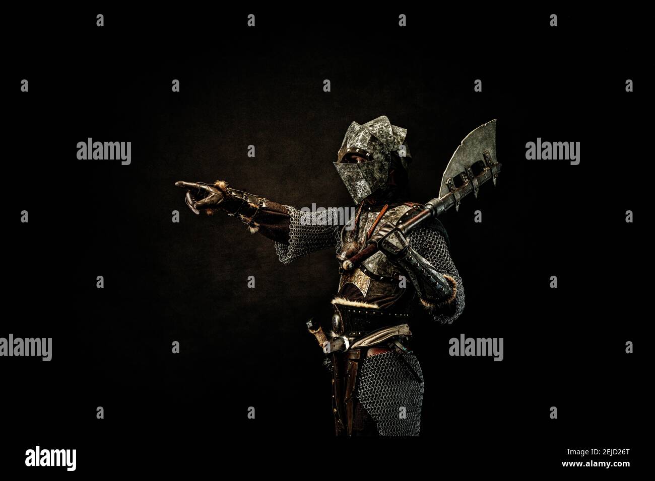 Medieval fighter in armor, pointing a finger at a direction, in profile ...