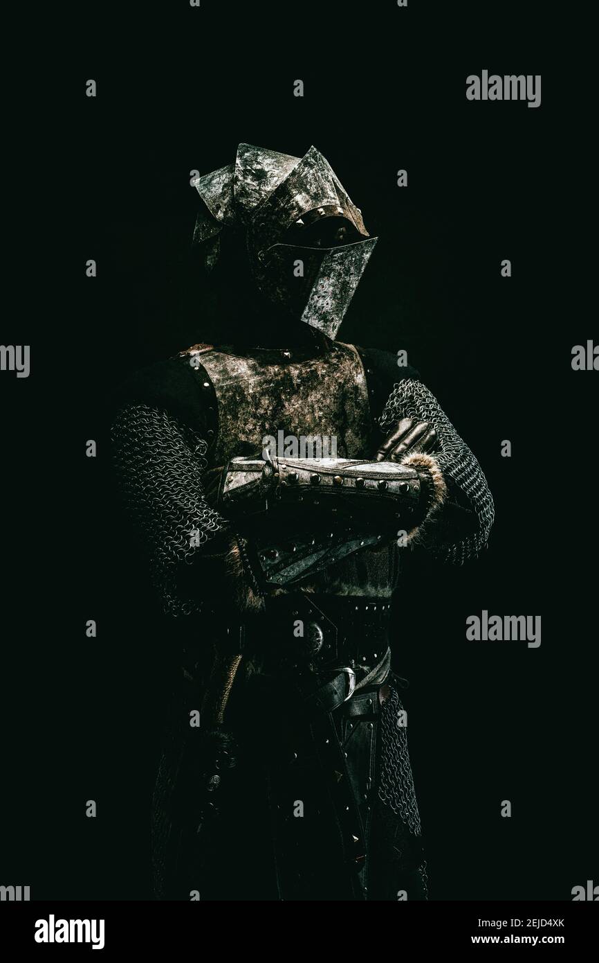Portrait of a medieval fighter in armor with his arms crossed Stock ...