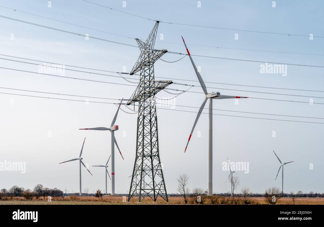 Power mast for high voltage electricity with cables in nice landscape ...