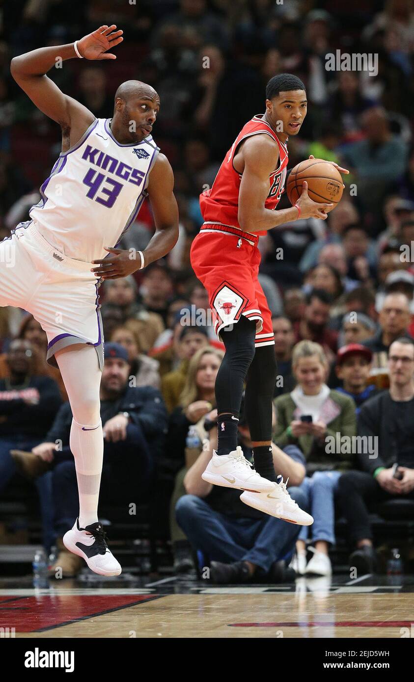 The Chicago Bulls' Shaquille Harrison, right, grabs a rebound ahead of ...