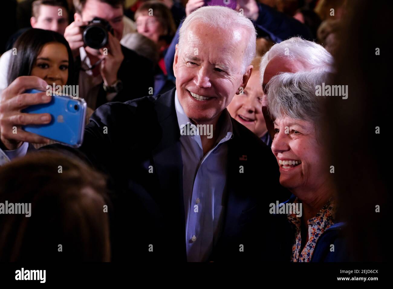 Former Vice President and presidential candidate Joe Biden poses for a selfie with his ...