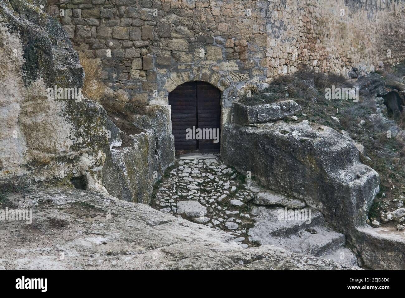 iron-lined gate to a medieval cave city-fortress Stock Photo - Alamy