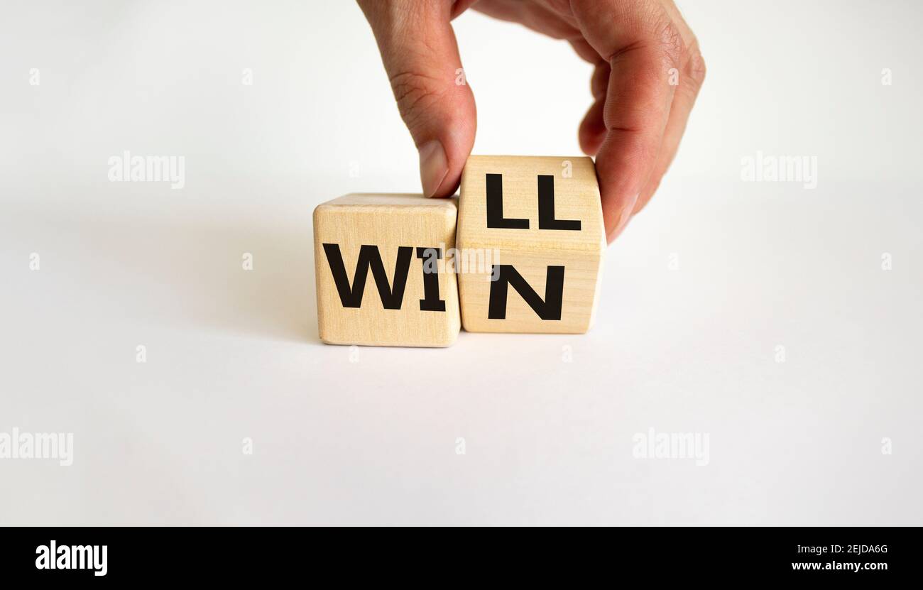 We will win symbol. Businessman turns cubes and changes the word will ...
