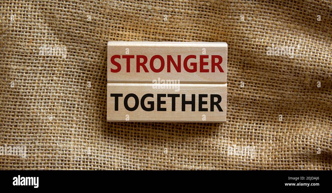 Stronger together symbol. Concept words 'stronger together' on wooden ...