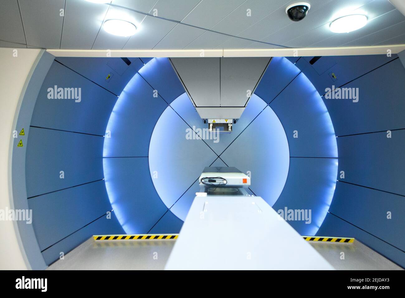 Proton therapy irradiates cancer cells with a beam of protons inside ...