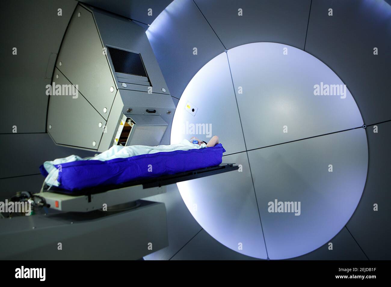 Proton therapy irradiates cancer cells with a beam of protons inside ...
