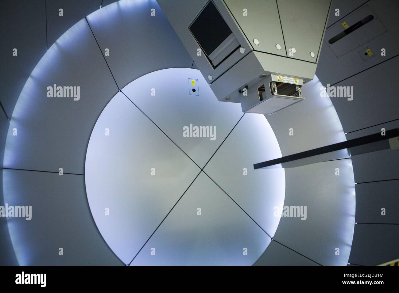 Proton therapy irradiates cancer cells with a beam of protons inside ...