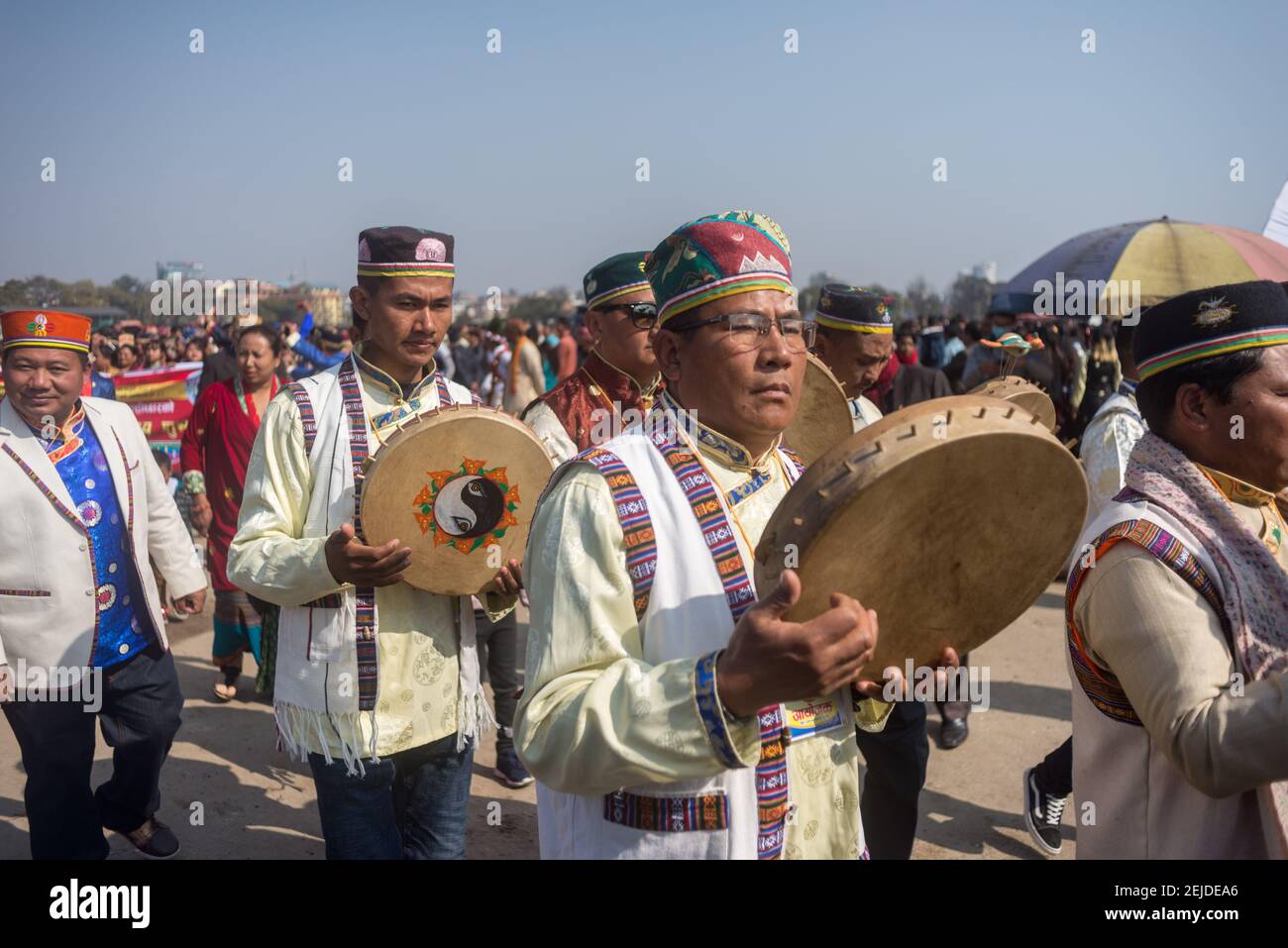 Tamang people in traditional costumes playing traditional drums during ...