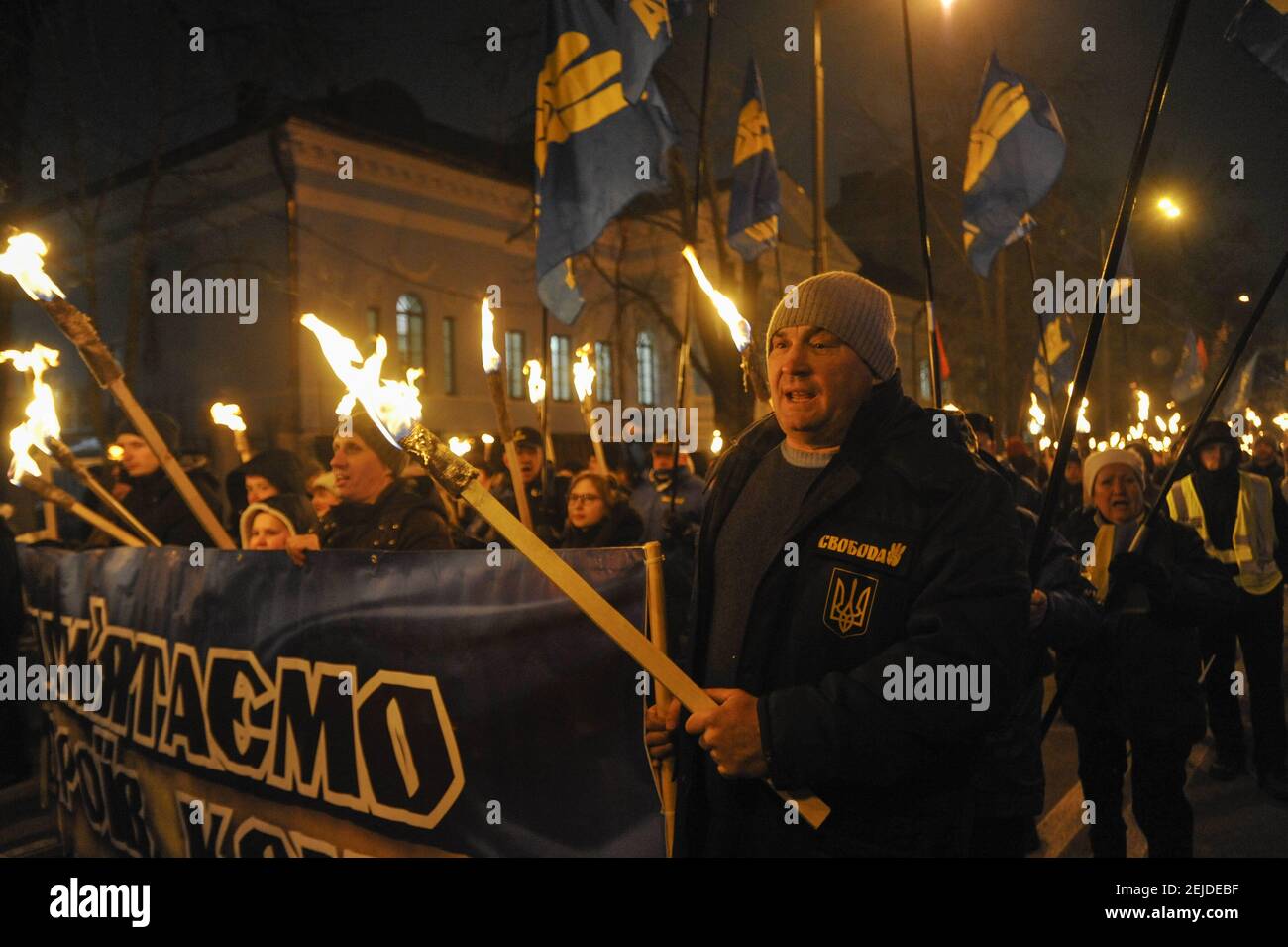 Members of the nationalist Svoboda (Freedom) party light torches during ...
