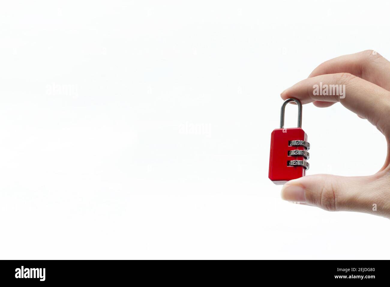 Small Red Lock In Hand on White Background. Hand holding small ...