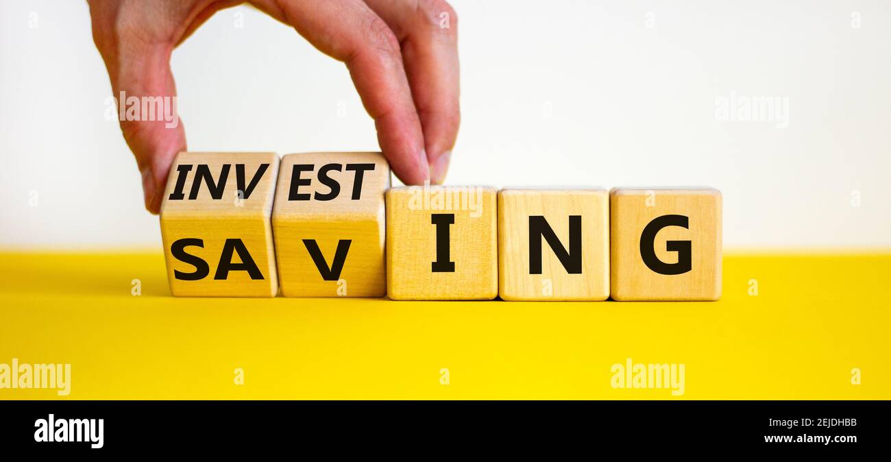 Saving or investing symbol. Businessman turns cubes and changes the ...