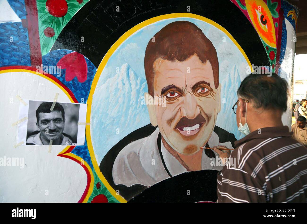 Fine artist busy in painting of Renowned Pakistani mountaineer Muhammad ...