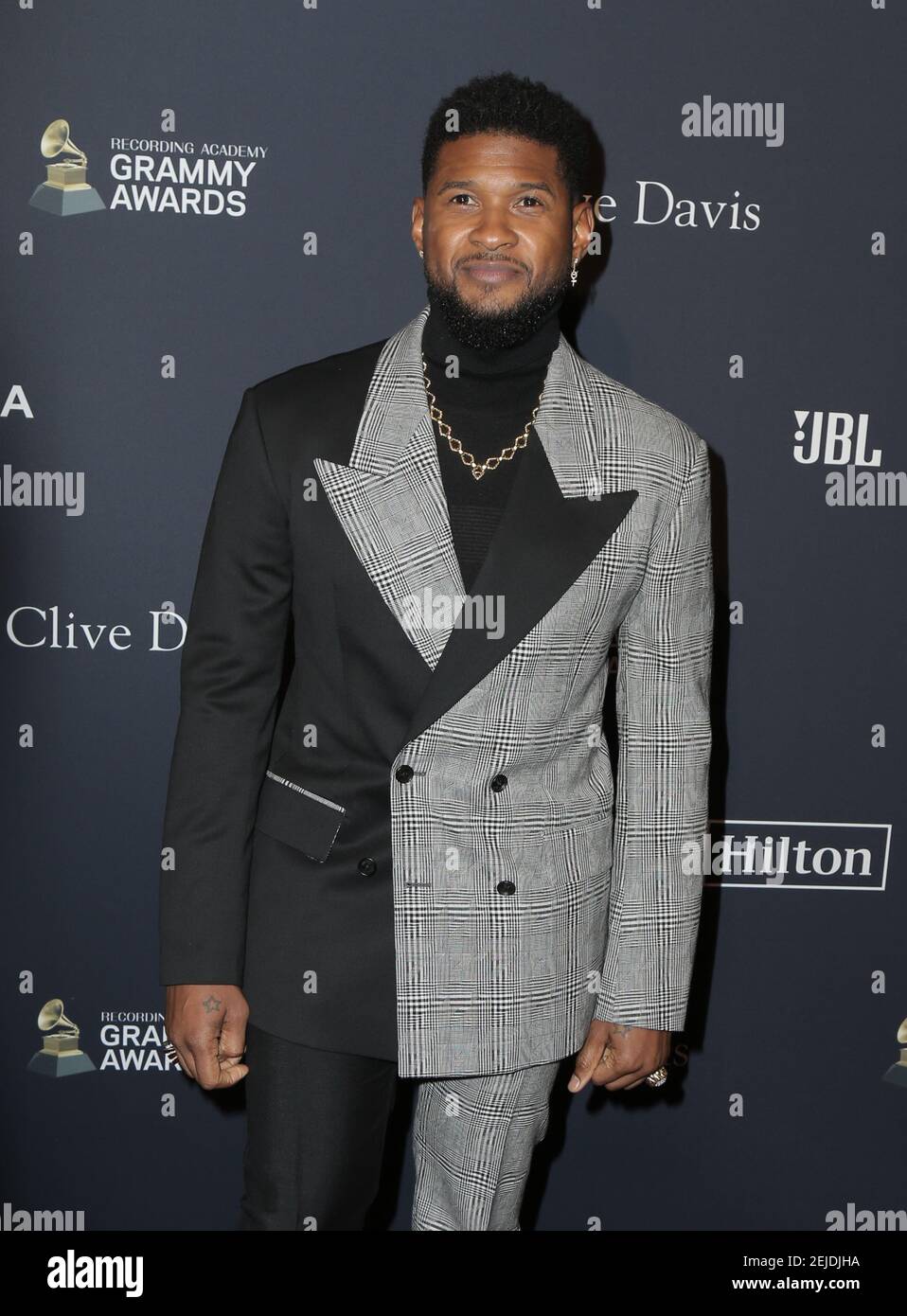 Usher walking the red carpet at the Clive Davis' 2020 Pre-Grammy Gala ...