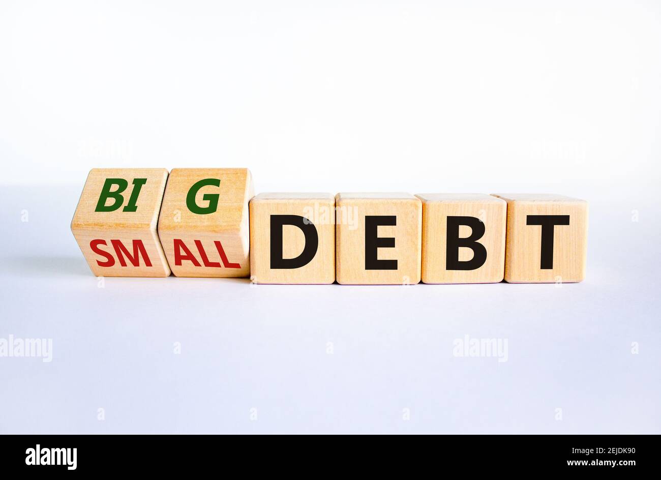 Big or small debt symbol. Turned wooden cubes and changed words 'small ...