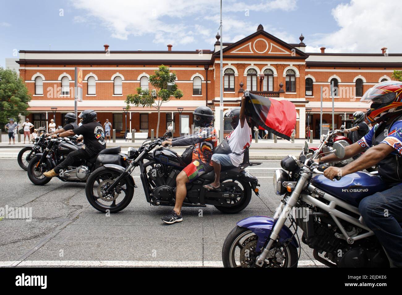 Indigenous Riders Club members lead the crowd past South Brisbane train ...