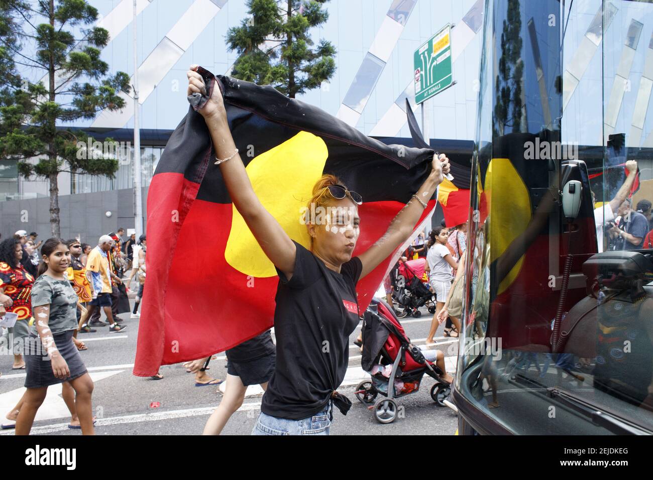 Protester with a flag marching through the streets of Brisbane during ...