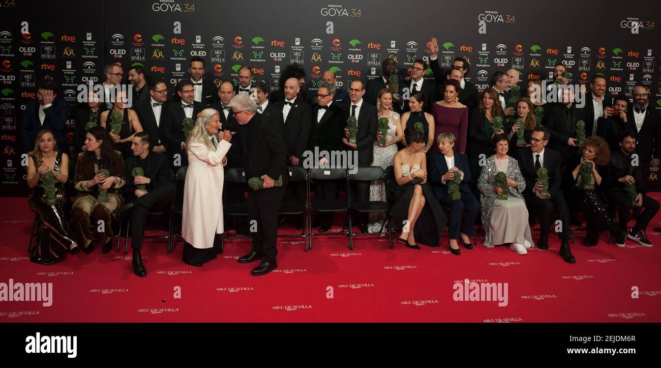 Actors and actresses pose for a photo family on the red carpet during ...