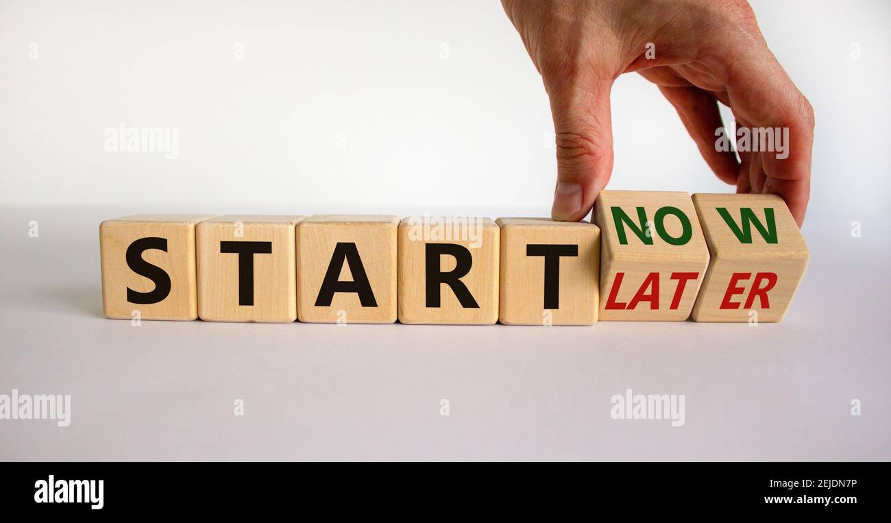 Start now or later symbol. Businessman turns wooden cubes and changes ...