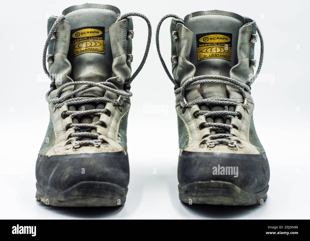 Old scuffed hiking boots isolated on white background Stock Photo - Alamy