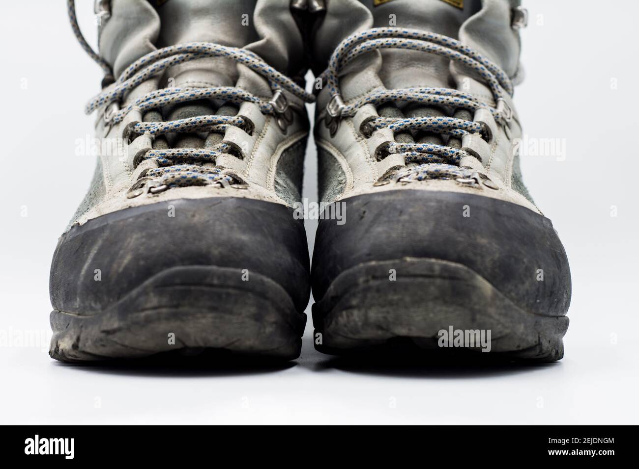 Old scuffed hiking boots isolated on white background Stock Photo - Alamy
