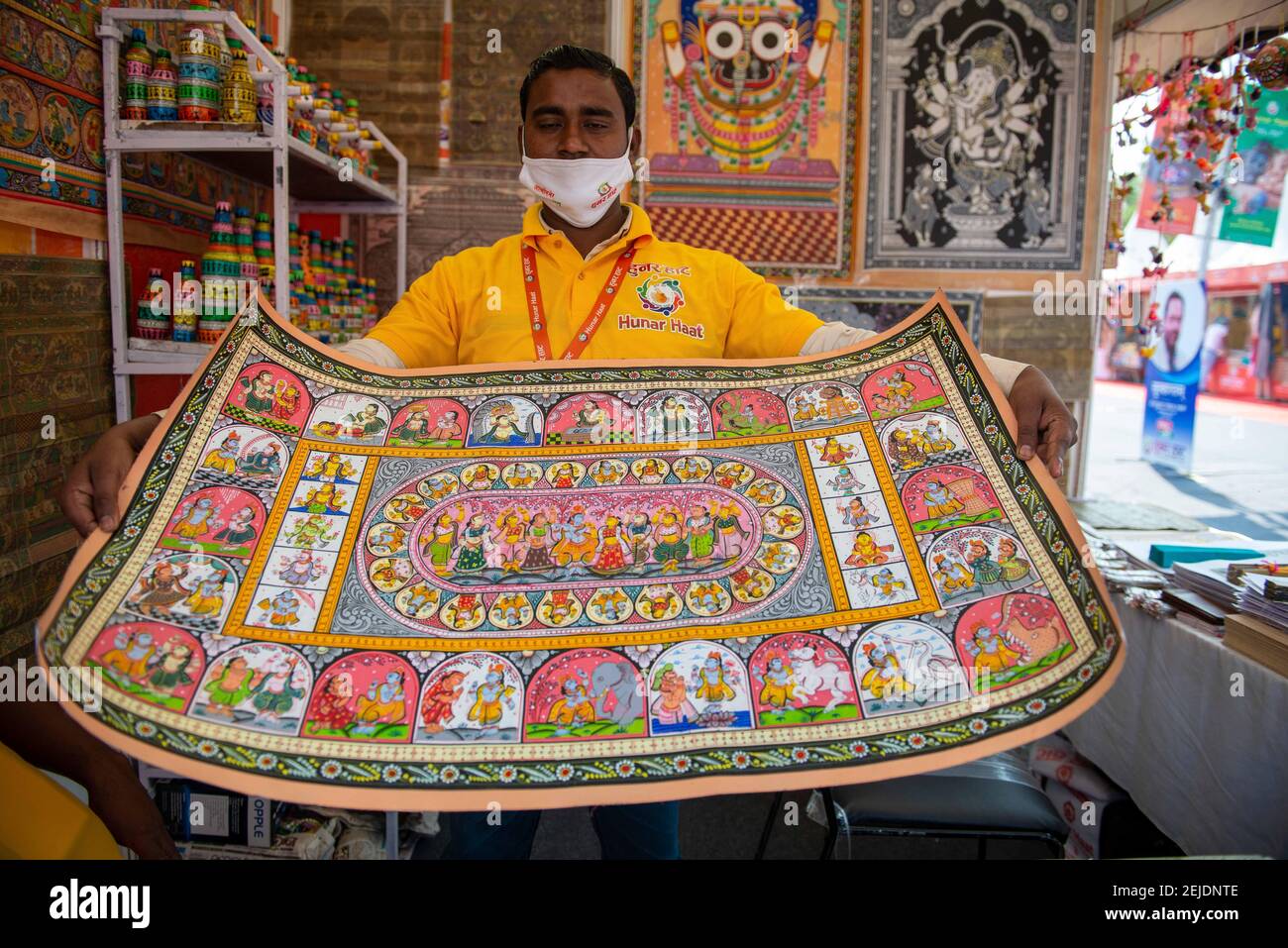 Satanam Nayak (30) from puri odisha, displays a Parttachitra painting ...