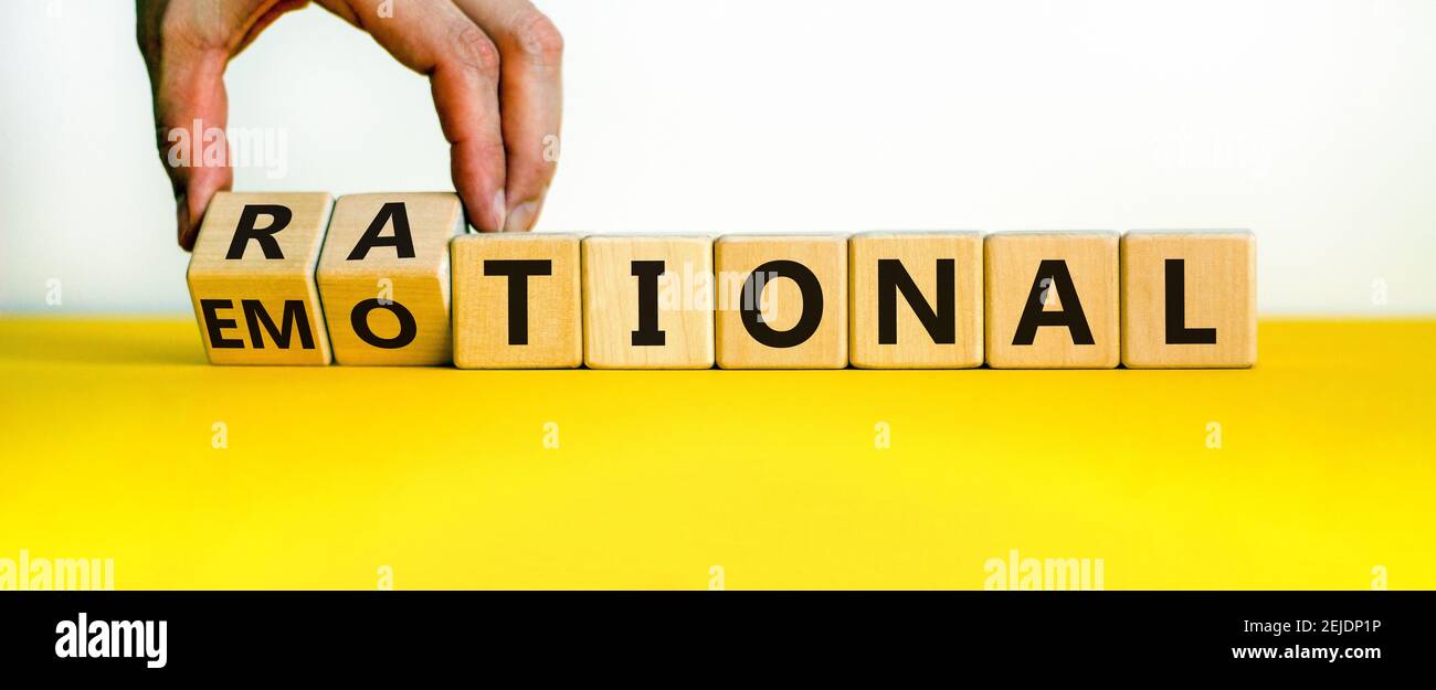 Rational or emotional symbol. Psychologist turns wooden cubes and ...