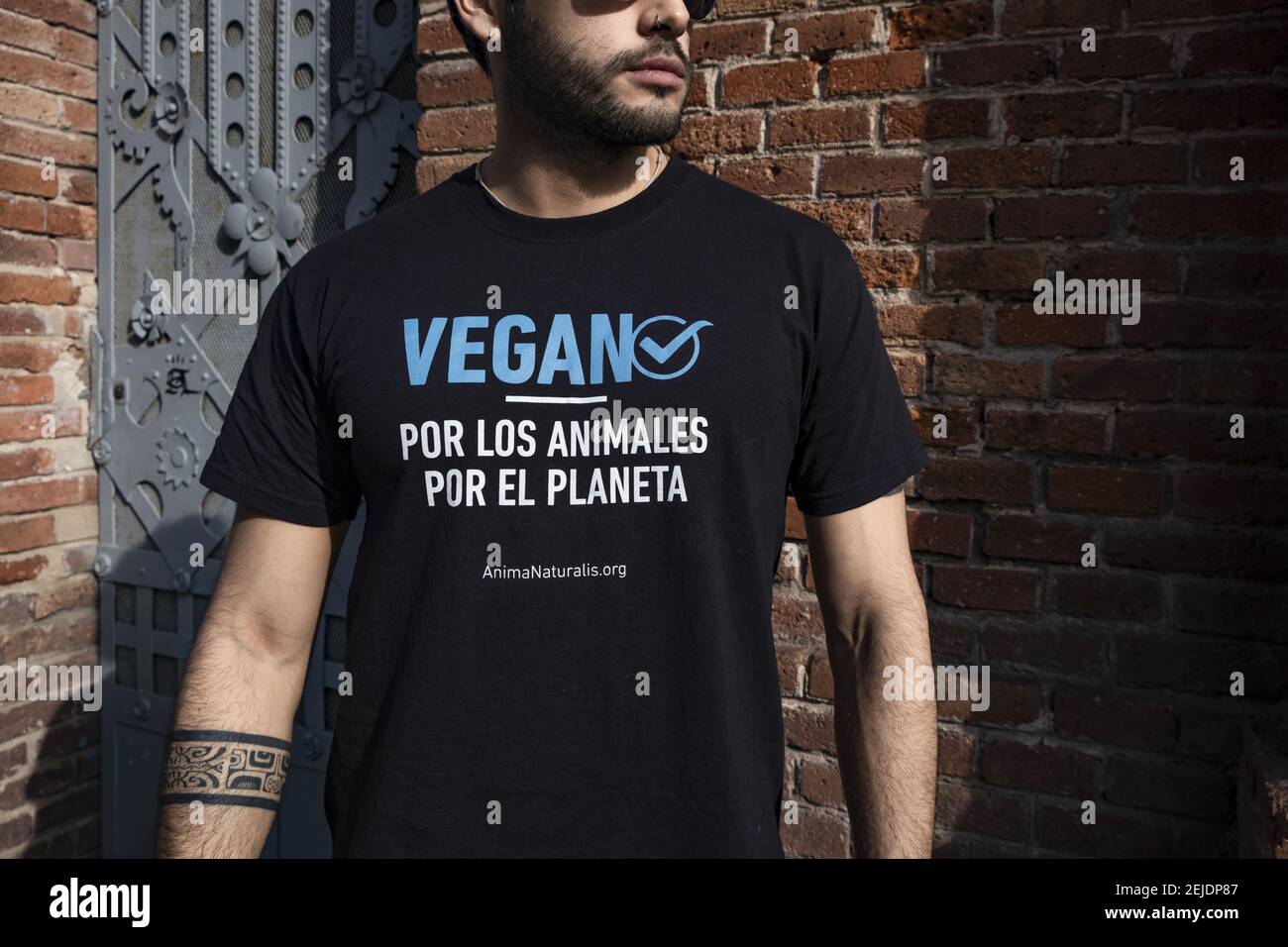 A pro-animal activist wearing a shirt with a slogans in defence of ...