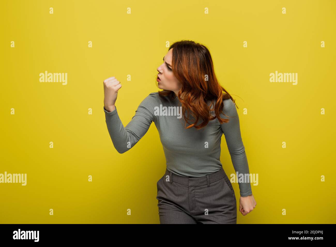 Angry woman showing fist hi-res stock photography and images - Alamy