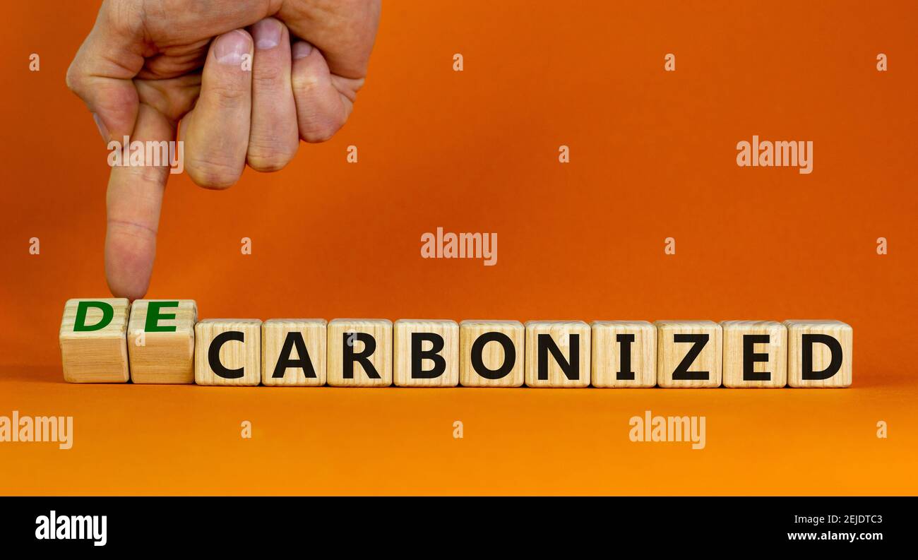 Carbonized or decarbonized symbol. Businessman turns wooden cubes and ...