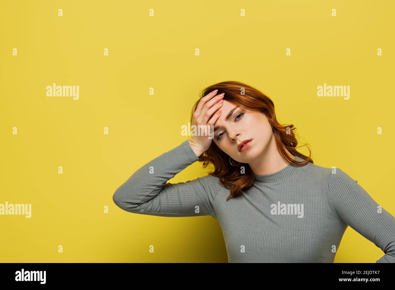 Stressed woman touching forehead hi-res stock photography and images ...