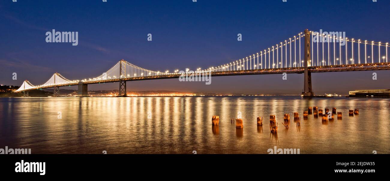 Suspension bridge over Pacific ocean lit up at night, Bay Bridge, San ...