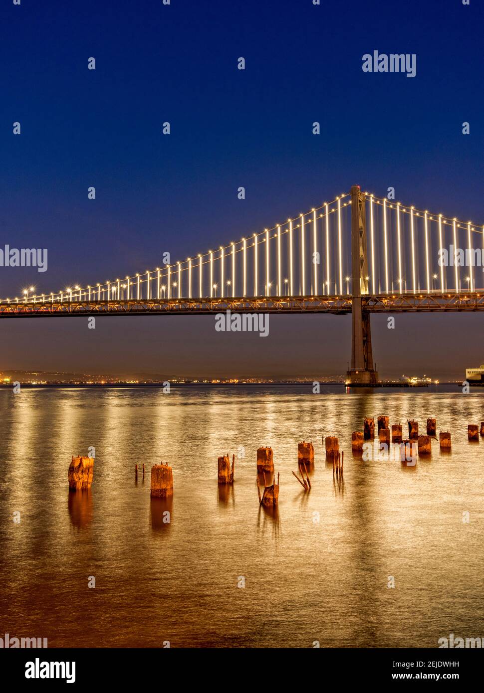 Suspension bridge over Pacific ocean lit up at night, Bay Bridge, San ...