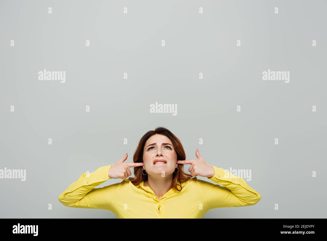 Plugging their ears hi-res stock photography and images - Alamy