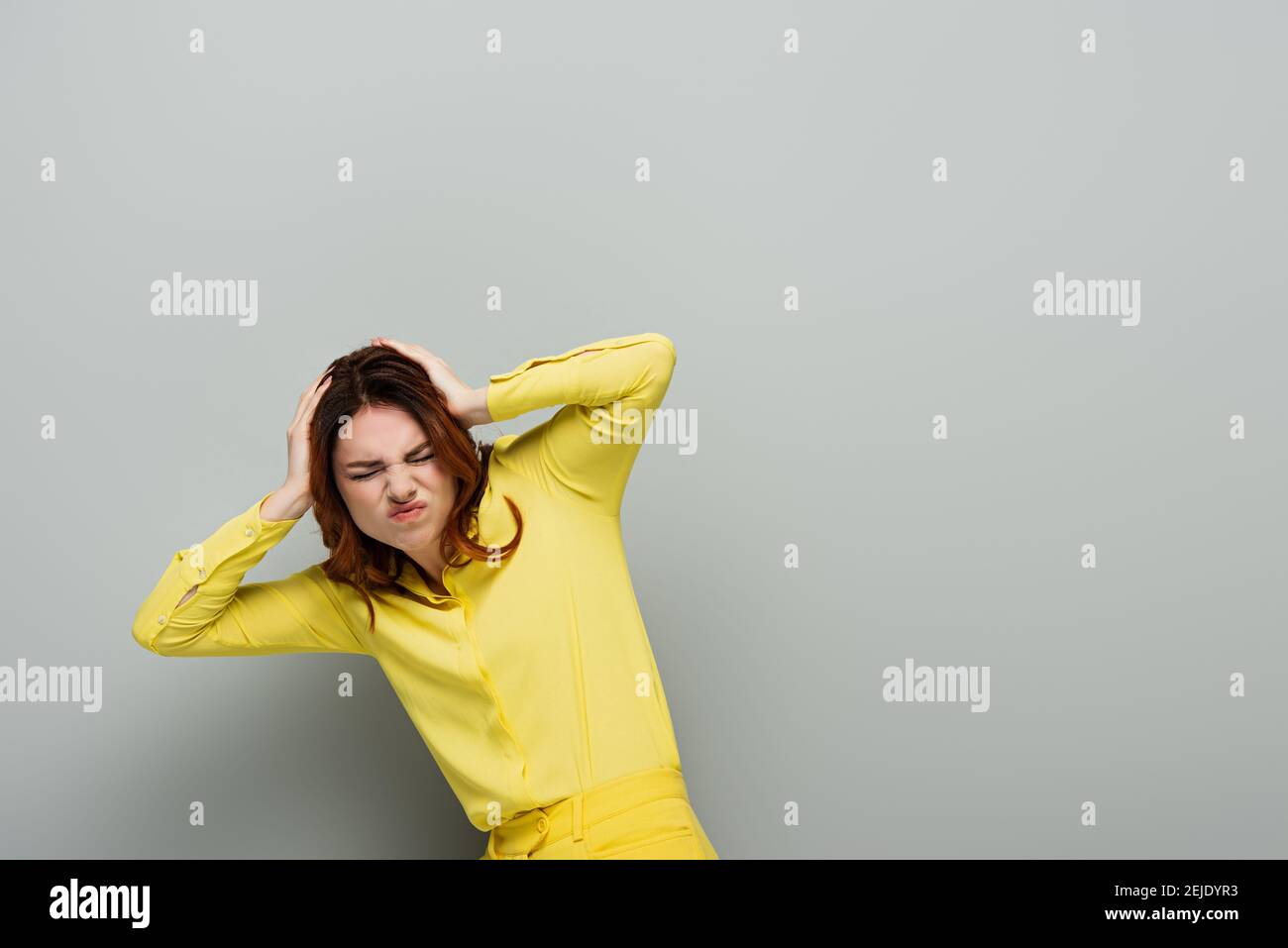 Frowning stressed young woman hi-res stock photography and images - Alamy