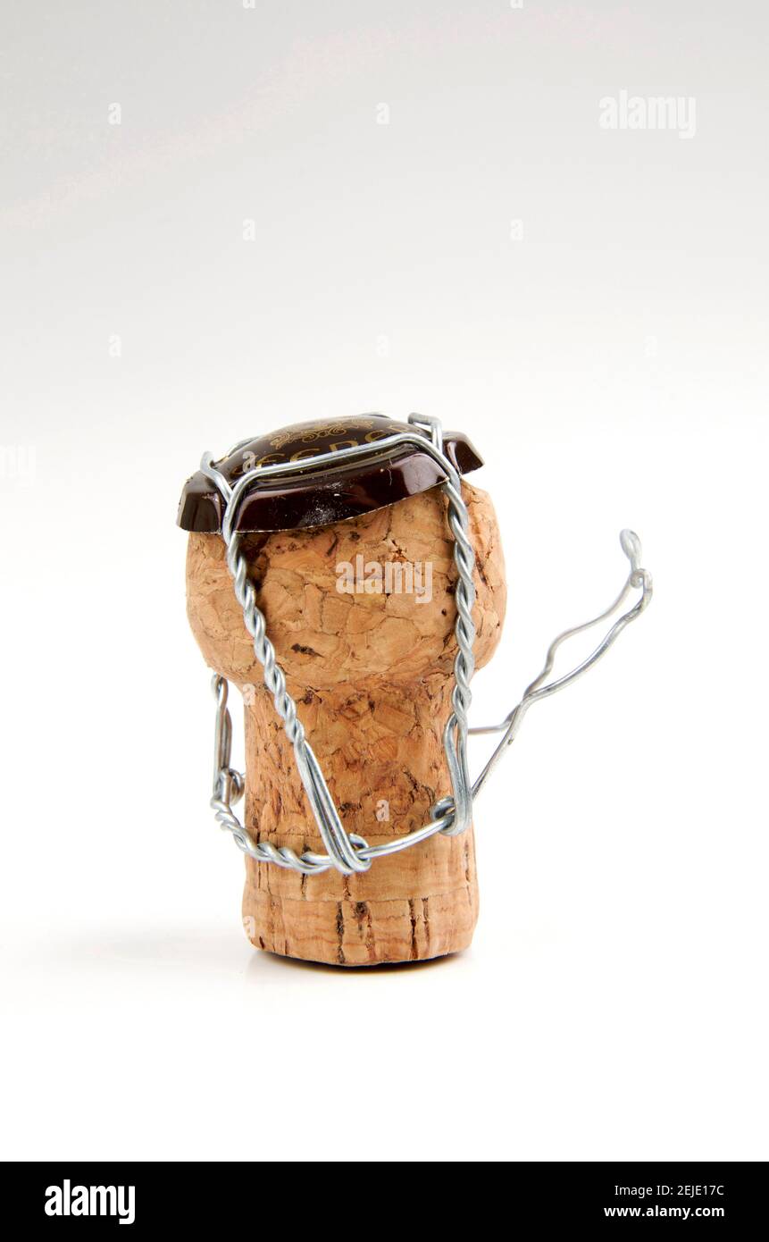 Champagne cork secured with wire cage ready for celebration in a ...