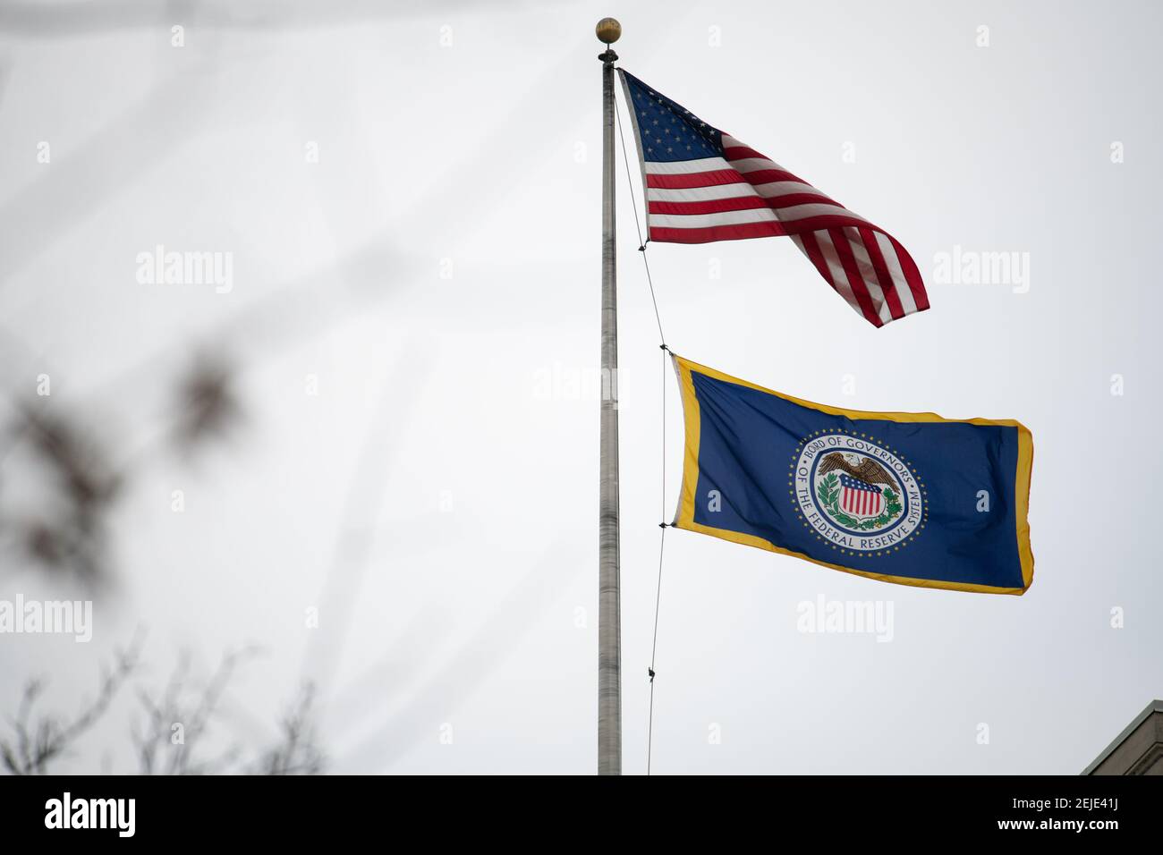Flags fly above the Federal Reserve in Washington, D.C., as seen on ...