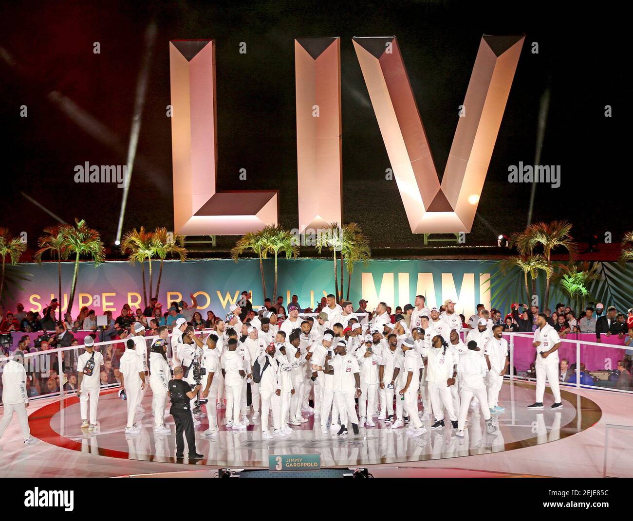 The San Francisco 49ers team takes the stage during Super Bowl Opening ...