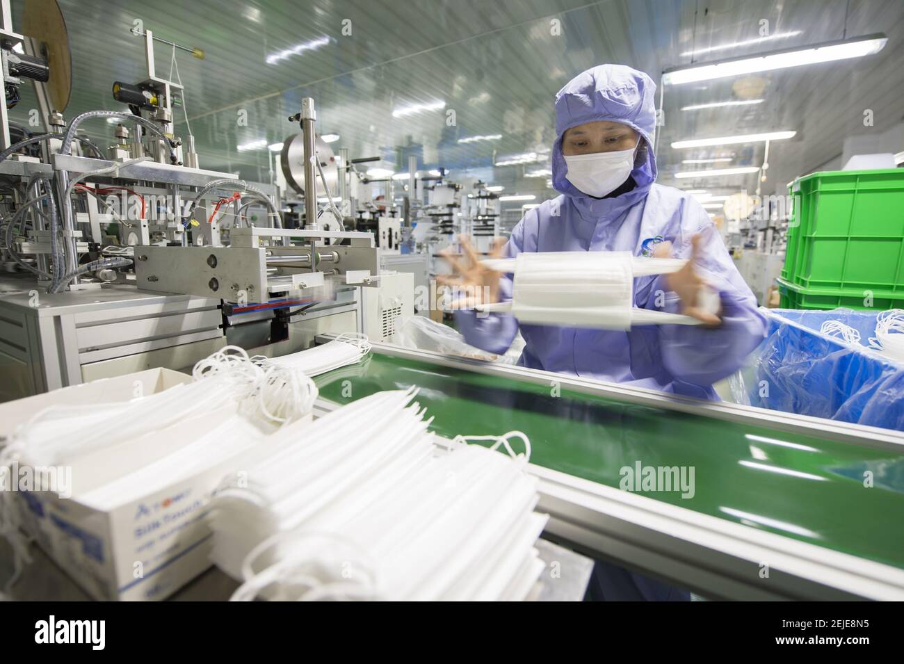 Chinese workers manufacture surgical face masks for prevention of the ...
