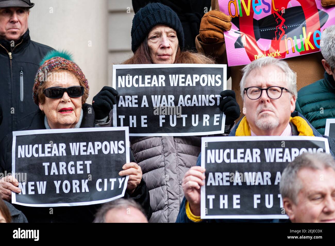 Activists rally at a press conference calling for the divestment from ...